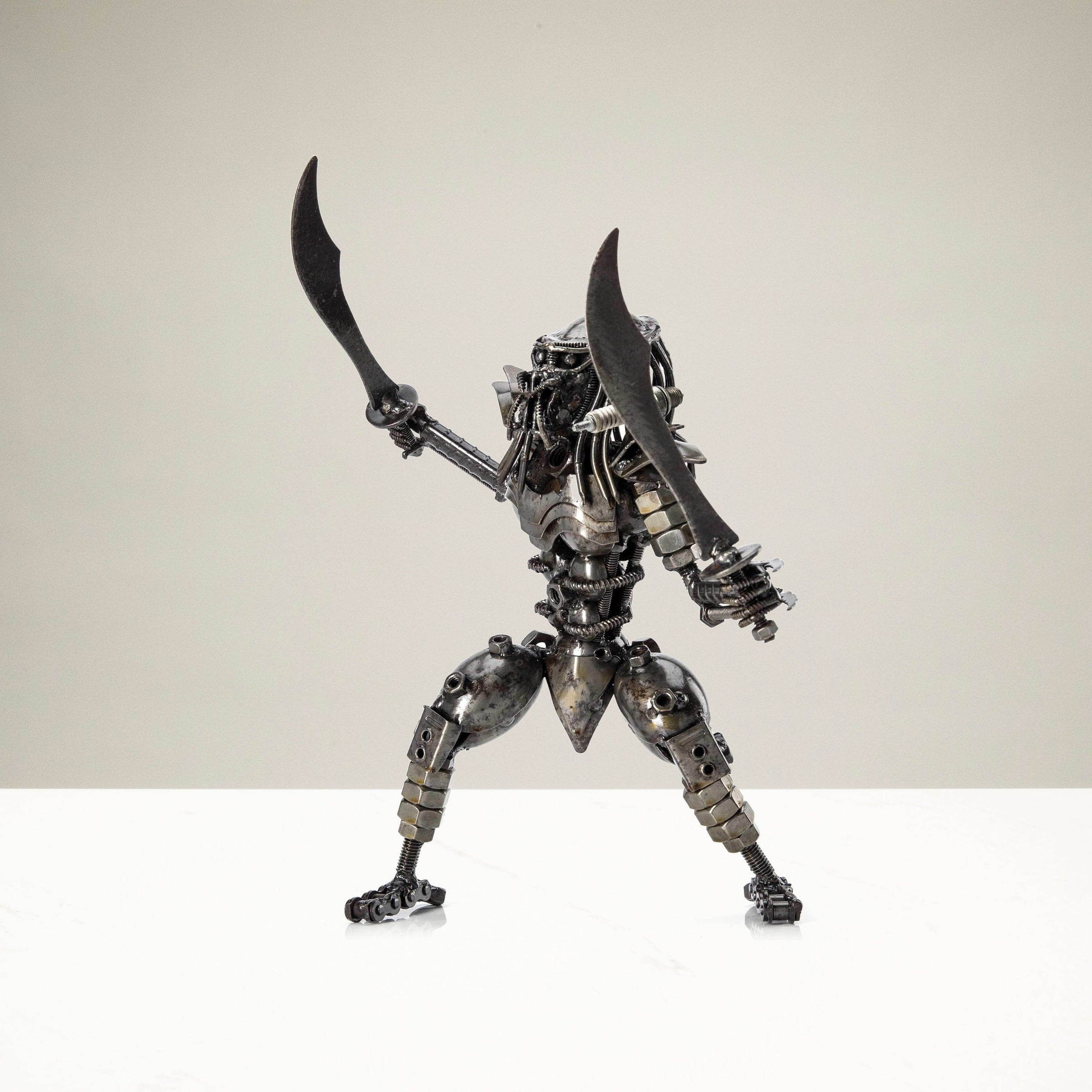 Predator with Dual Wielded Sword Recycled Metal Sculpture | KALIFANO